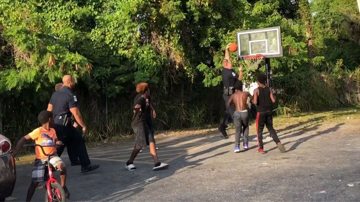 Police Officers Show Off Basketball Skills With Local Kids