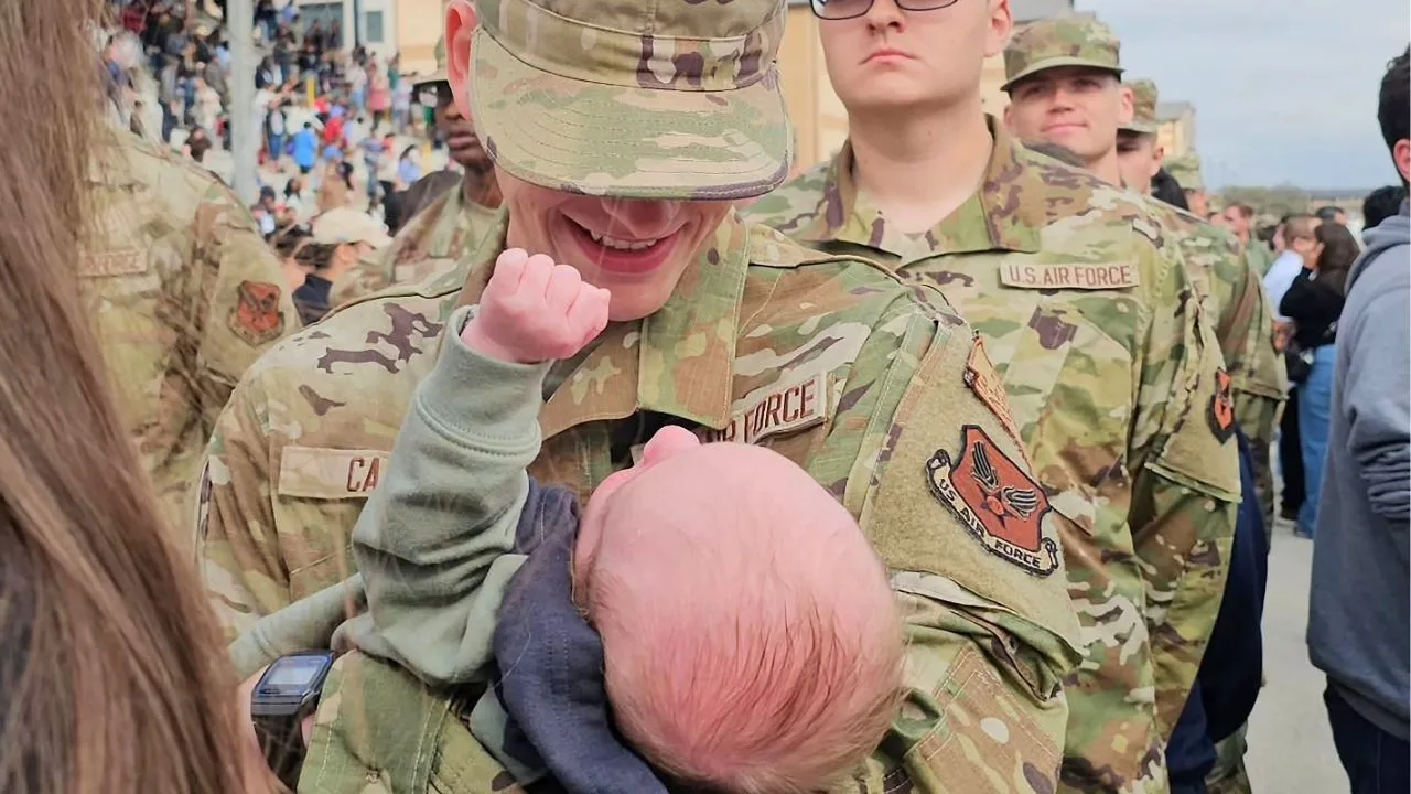 Airman Meets Newborn Son For First Time At Graduation
