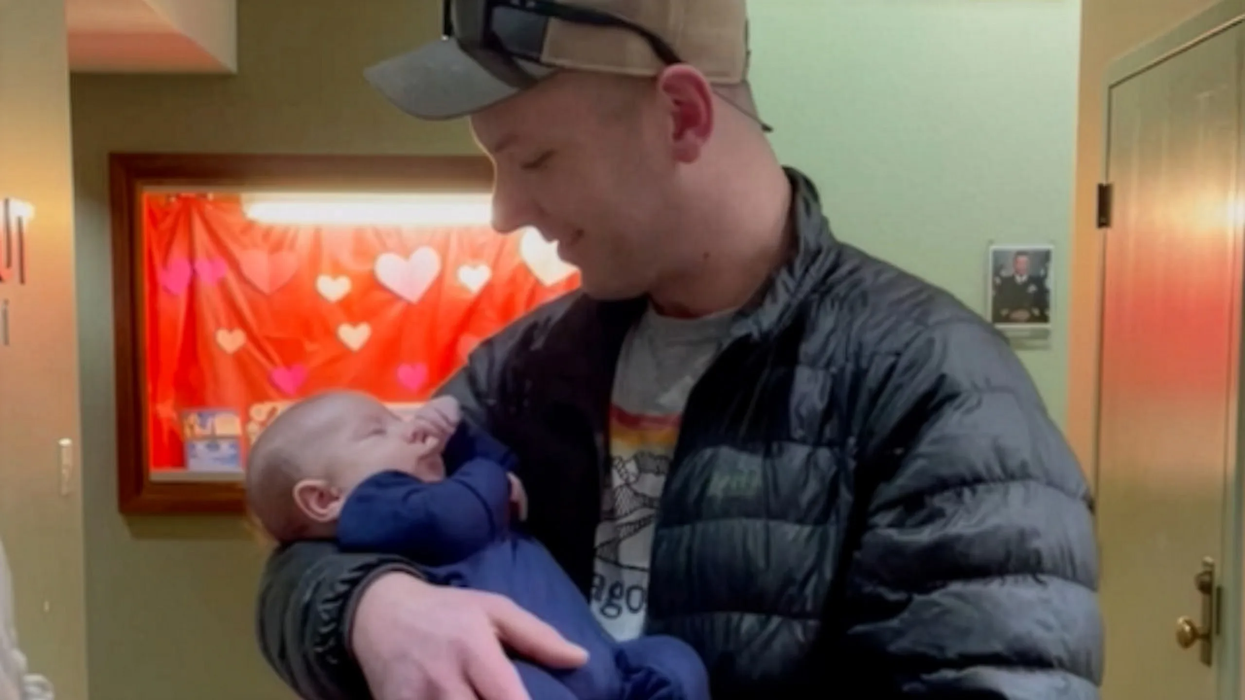 Deployed Sailor Meets Newborn Baby For The First Time On Base